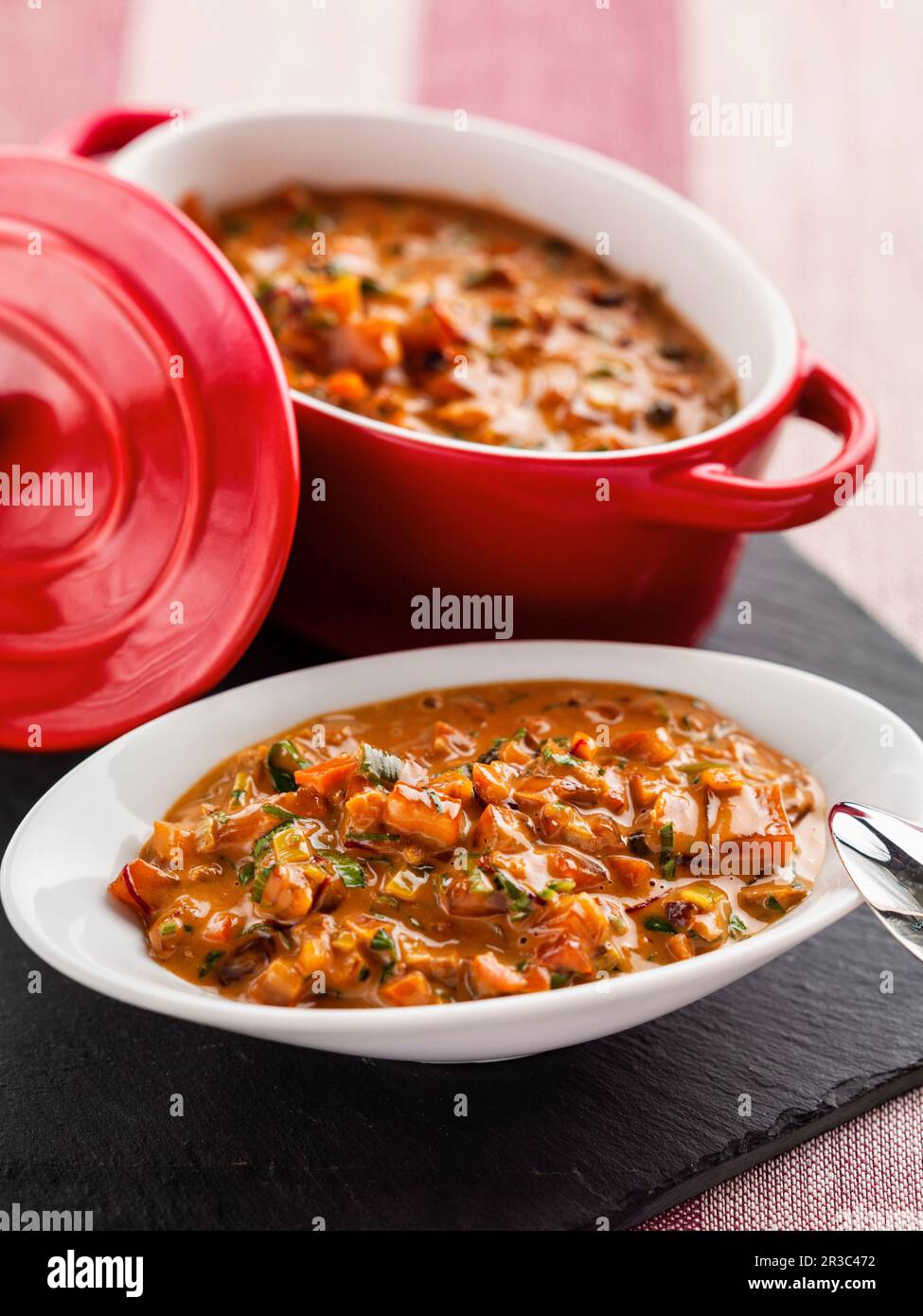 Ragout with pork knuckle and vegetables Stock Photo - Alamy