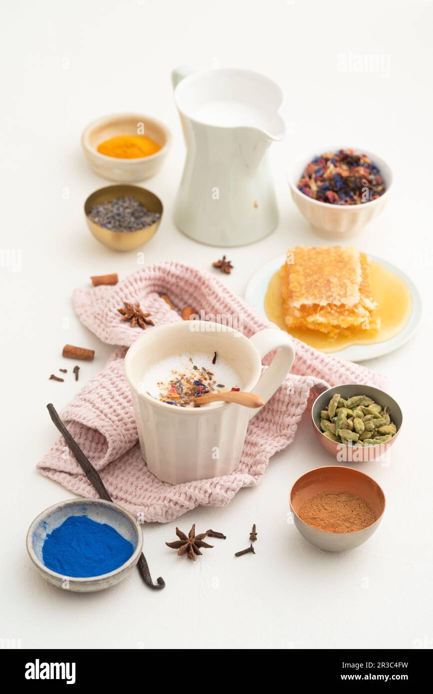 Moon Milk with cinnamon, honeycomb, edible flowers, spices and ...