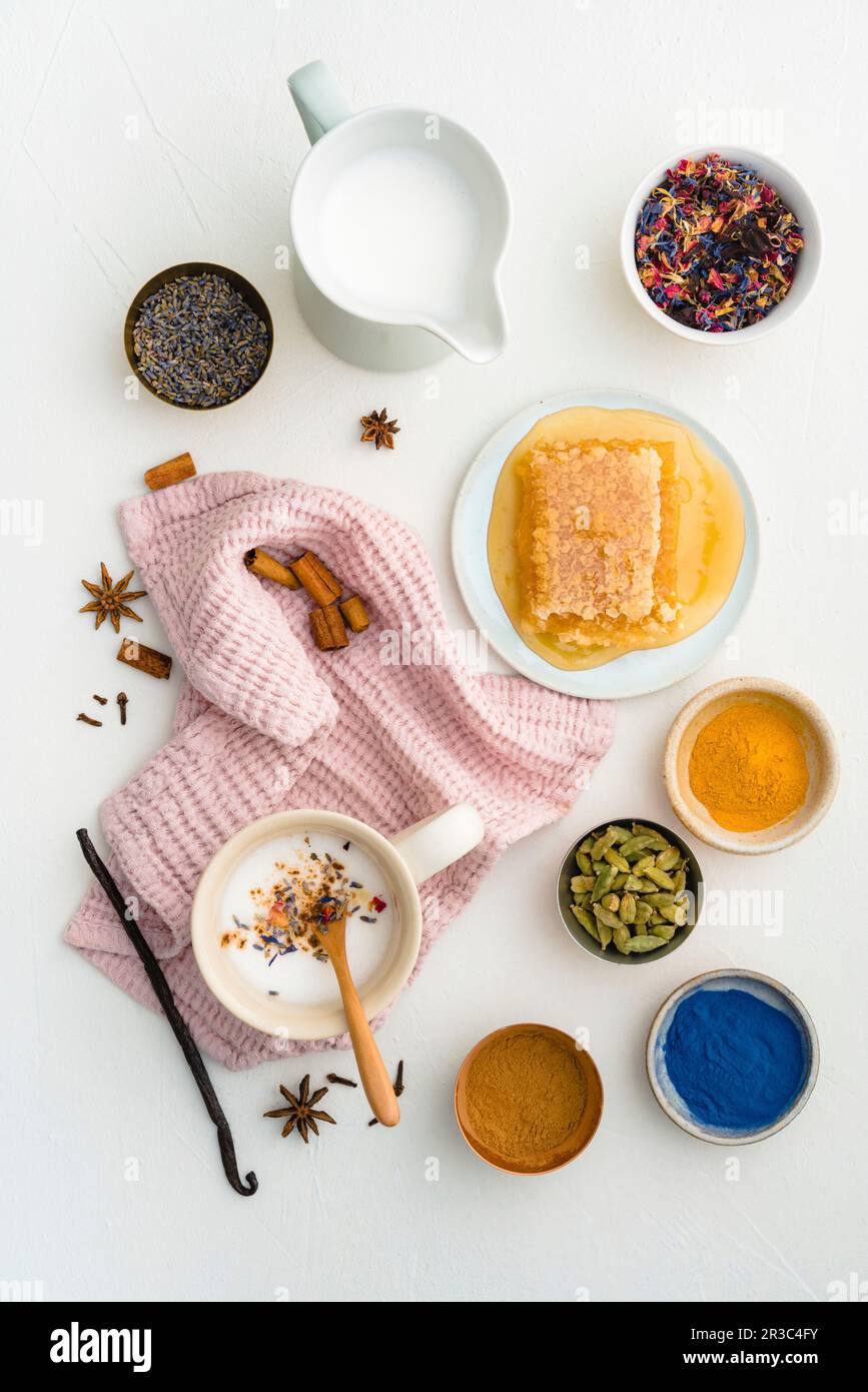 Moon Milk with cinnamon, honeycomb, edible flowers, spices, and ...