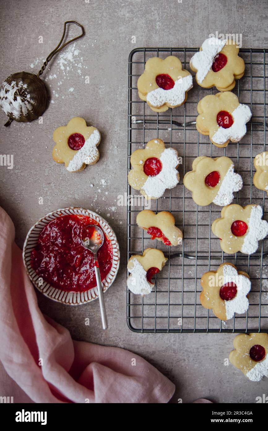 Flower biscuits with raspberry jam Stock Photo - Alamy