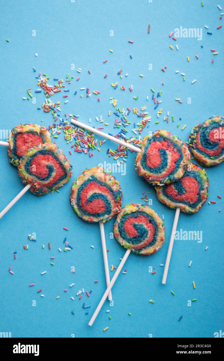 Vegan shortbread biscuits with colourful sugar sprinkles on a stick ...
