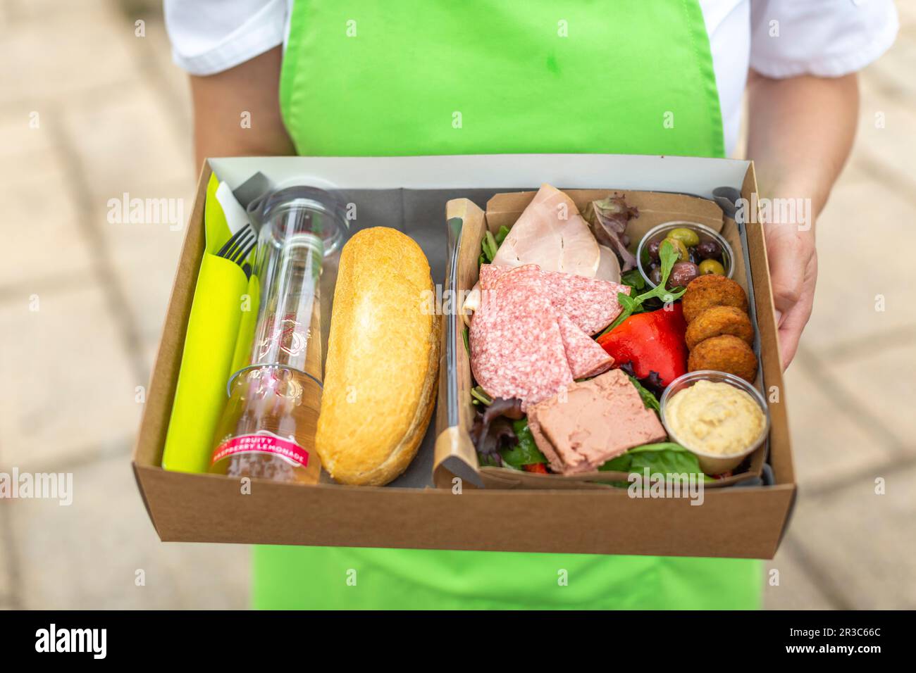 Lunch box with bread, falafel, hummus, sausage, pate and salad Stock ...