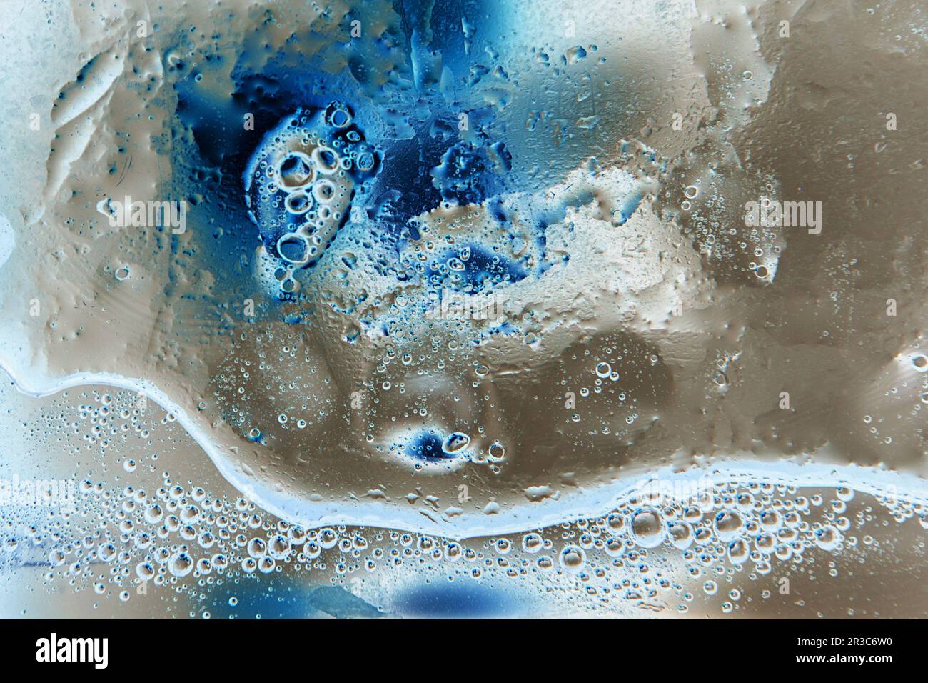 Abstract background of oil mixed with water in different color ...