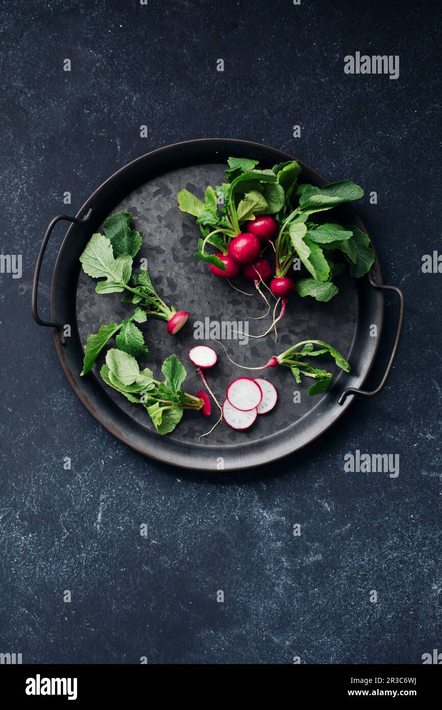 Whole and sliced radishes Stock Photo - Alamy