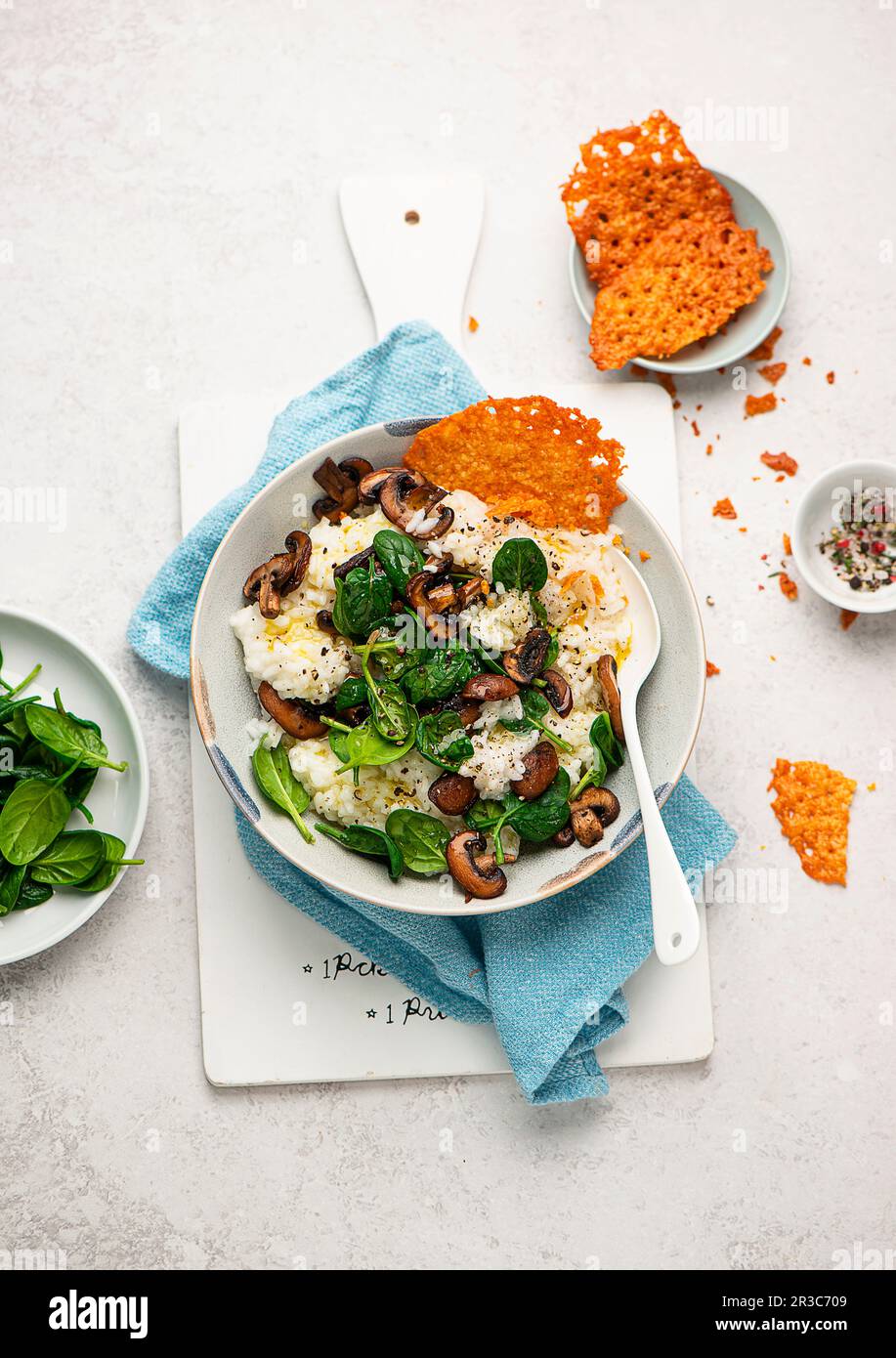 Veggie risotto with parmesan chips Stock Photo - Alamy
