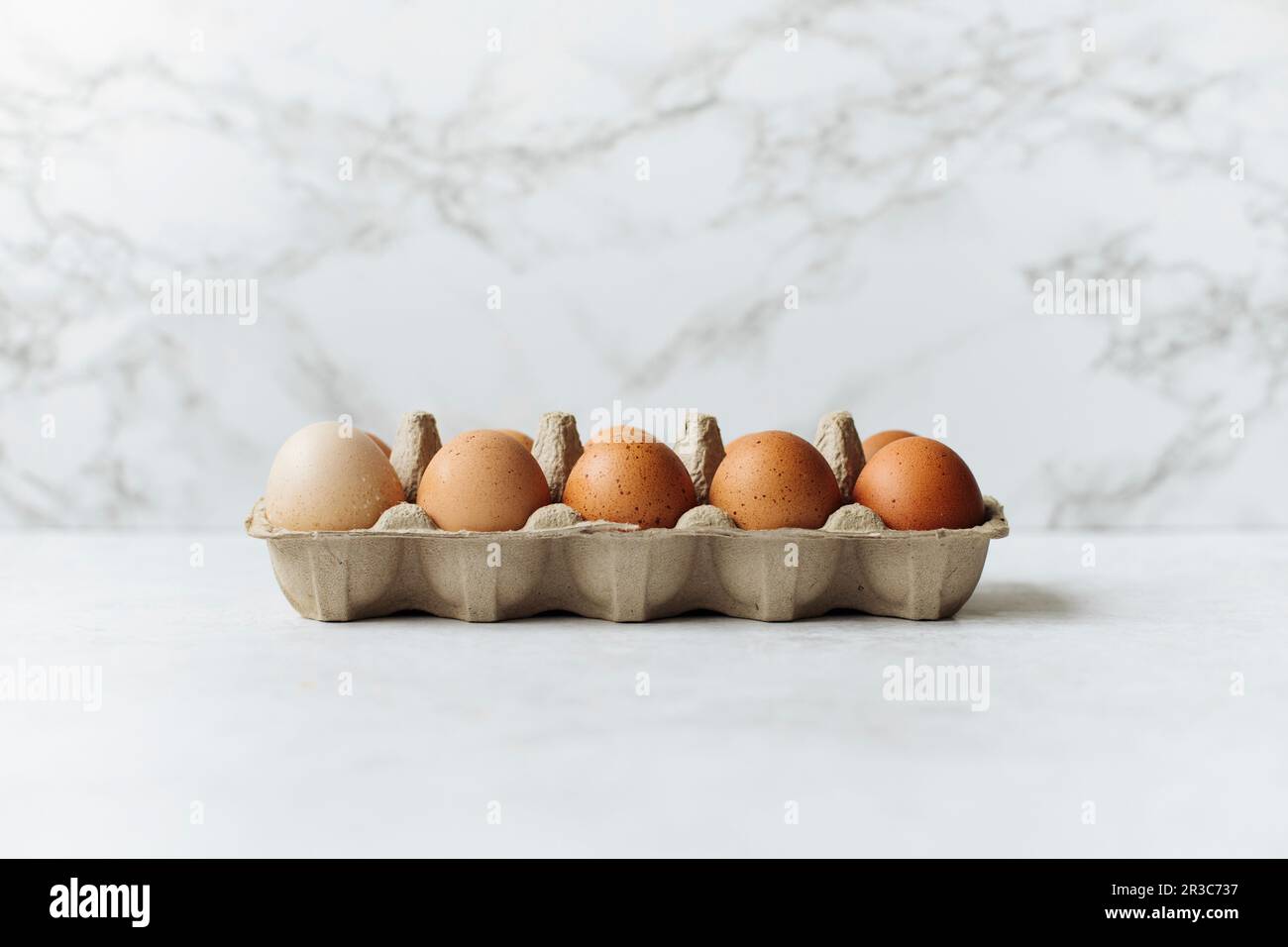 Fresh eggs in an egg box Stock Photo - Alamy