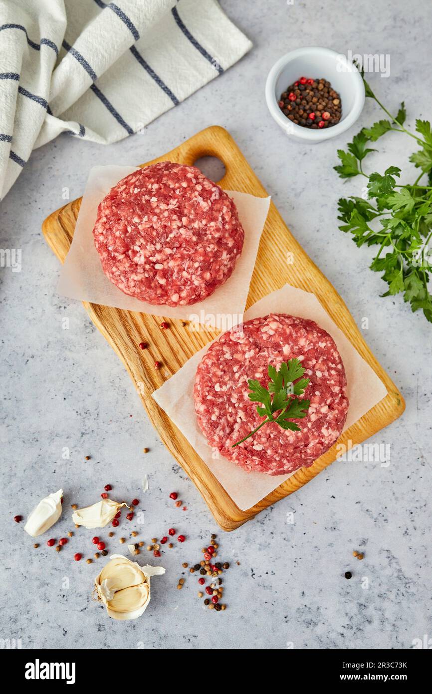 Fresh raw burger patties Stock Photo - Alamy