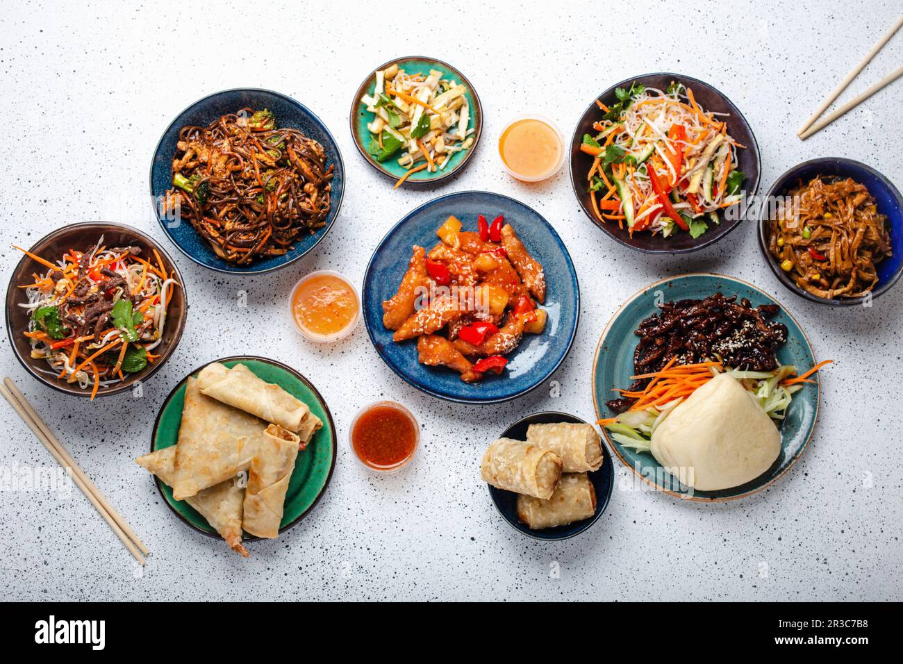 Set of Chinese dishes on white table Stock Photo - Alamy