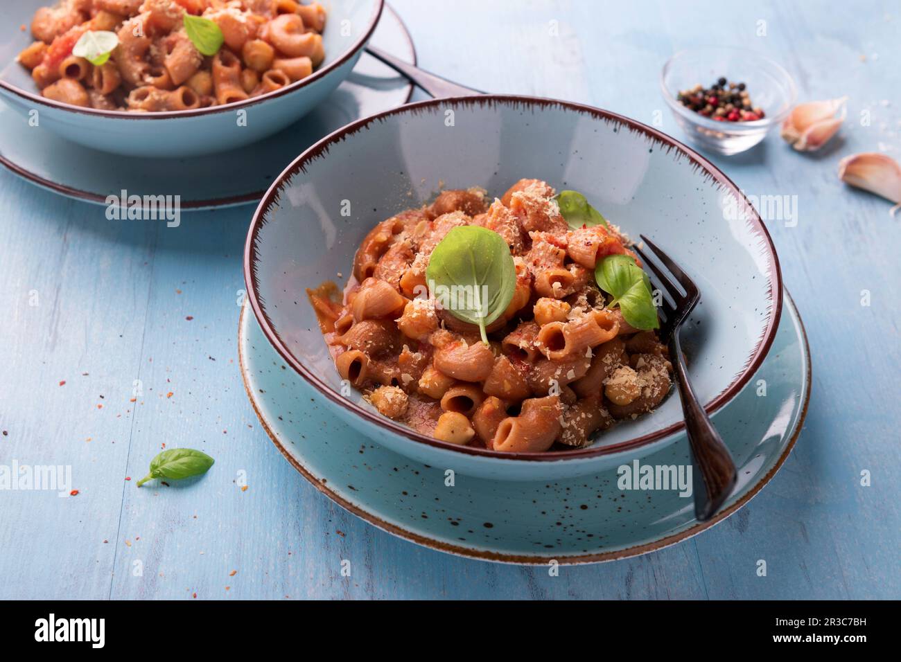 Vegan wholemeal spelt pasta with tomato and chickpea sugo Stock Photo ...
