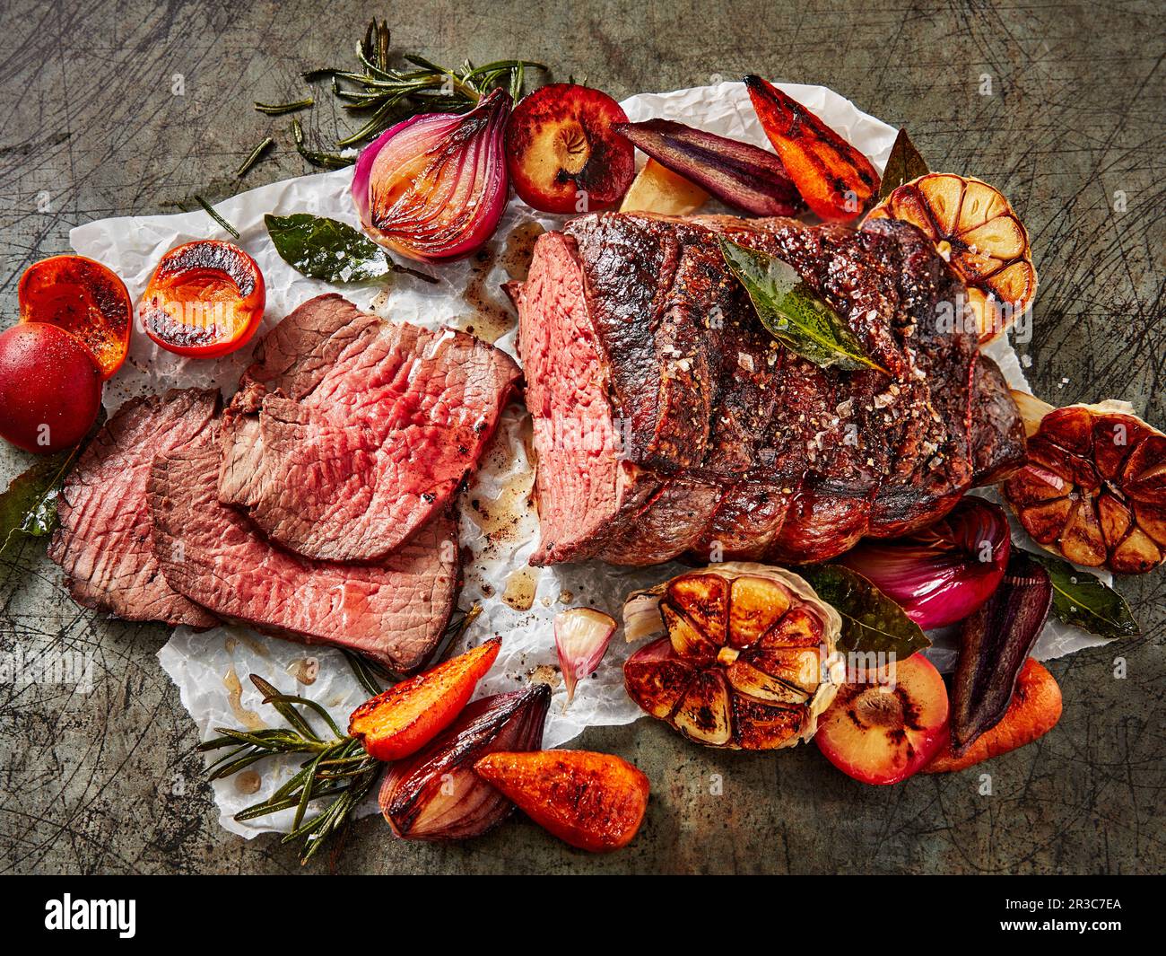 Beef topside with garlic, onion and fruit Stock Photo - Alamy