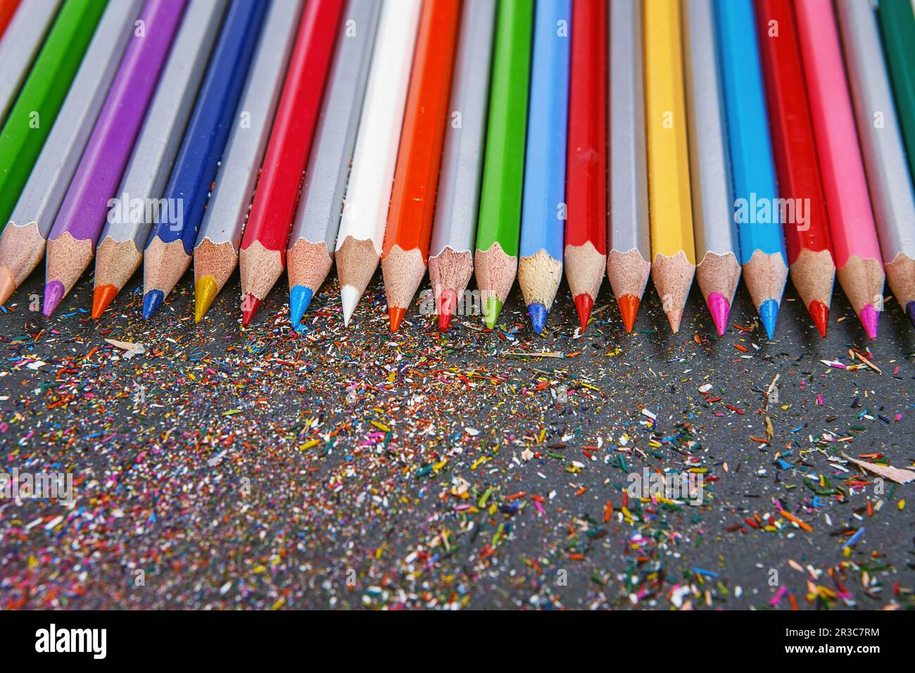 Close up shot of colored pencil crayons and pencil crayons shavings on ...