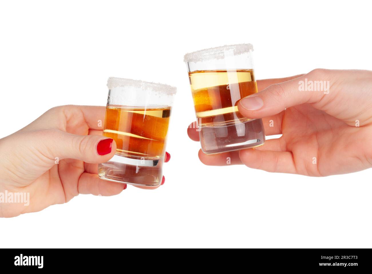 Two hands clinking shots of alcoholic beverage together Stock Photo - Alamy