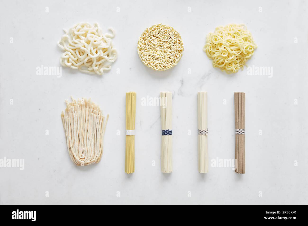 Noodles laid out on white marble Stock Photo - Alamy