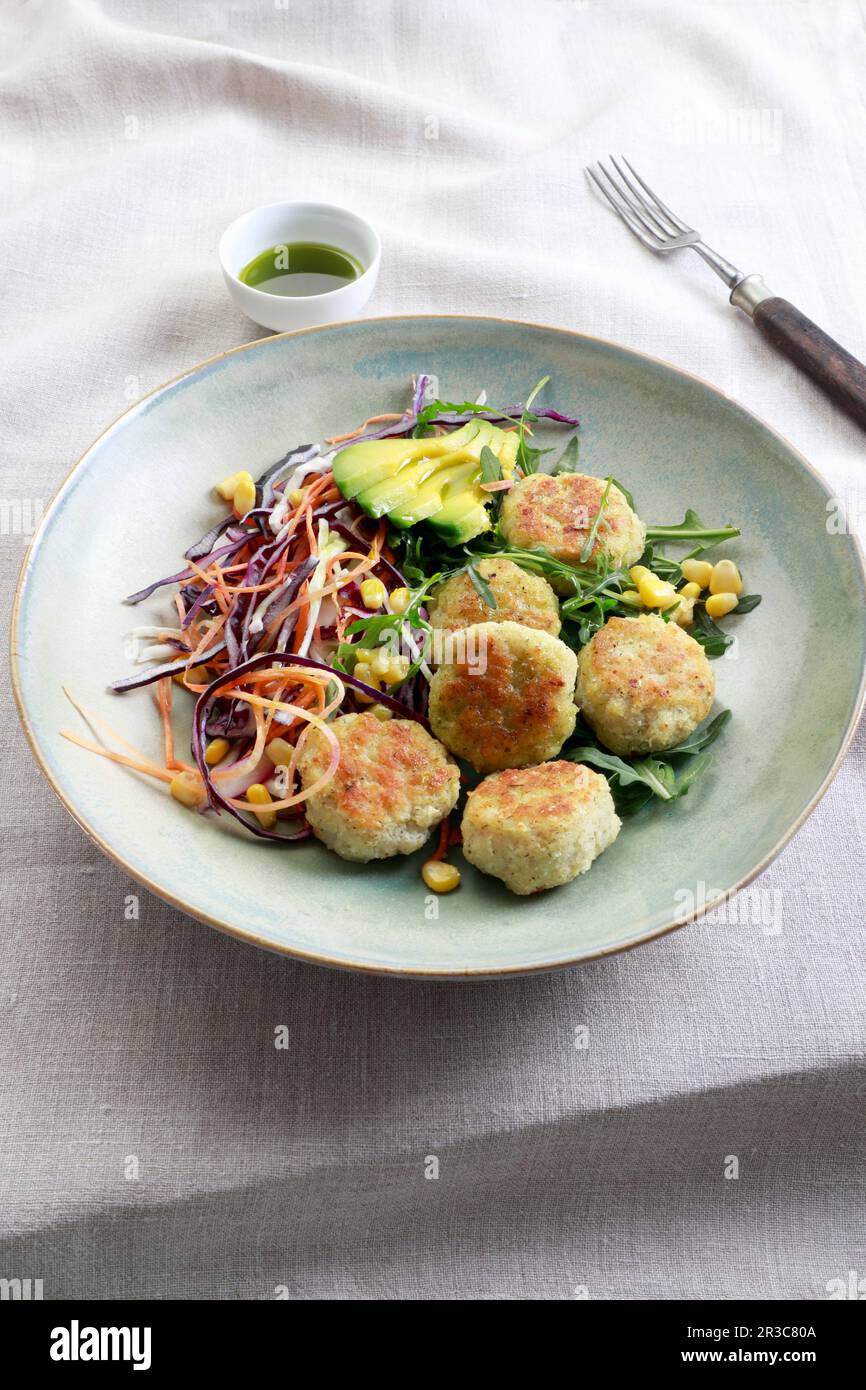 Cod meatballs served with cabbage salad Stock Photo - Alamy