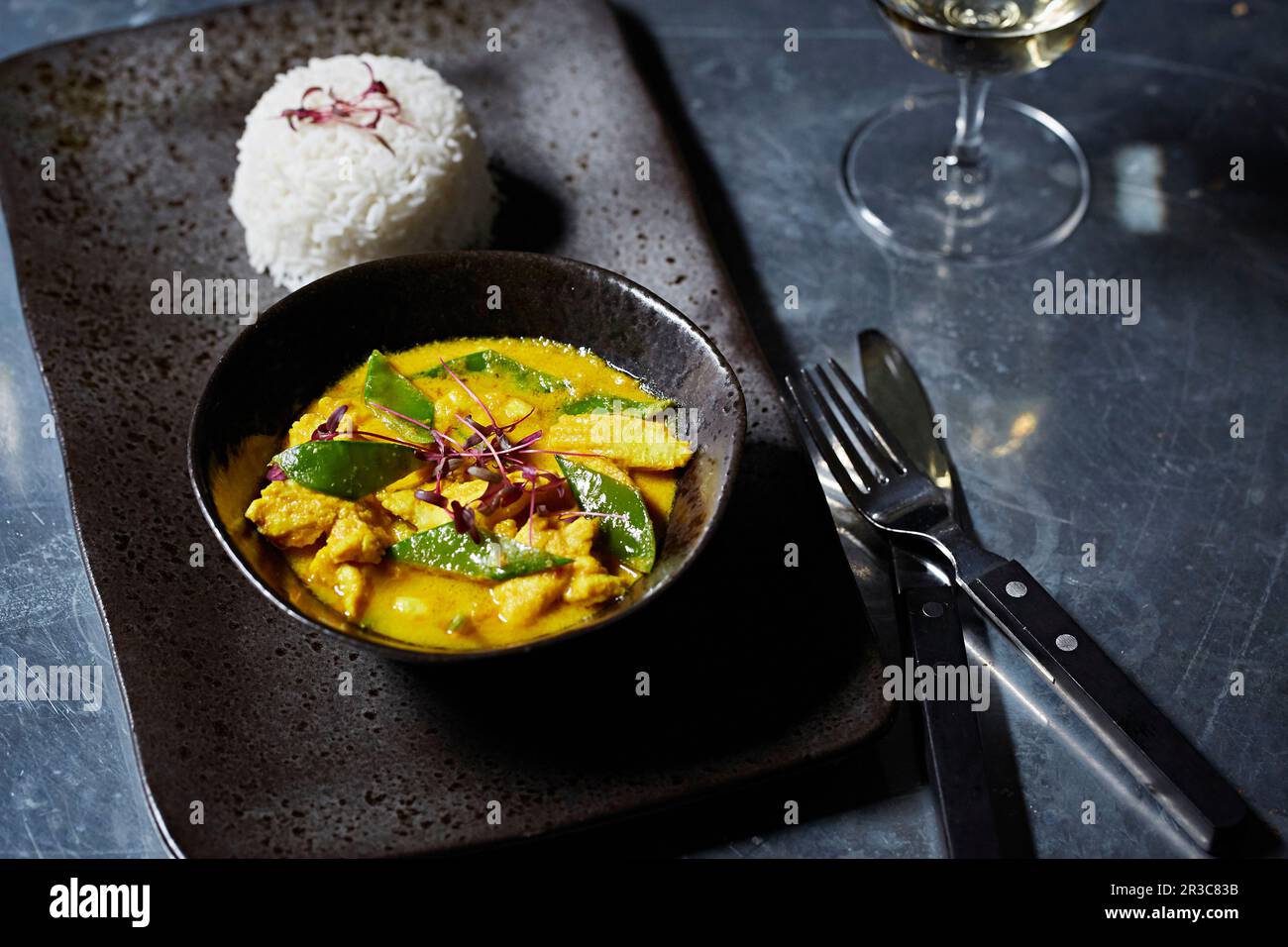 Thai-style chicken curry with baby corn and mange tout Stock Photo - Alamy
