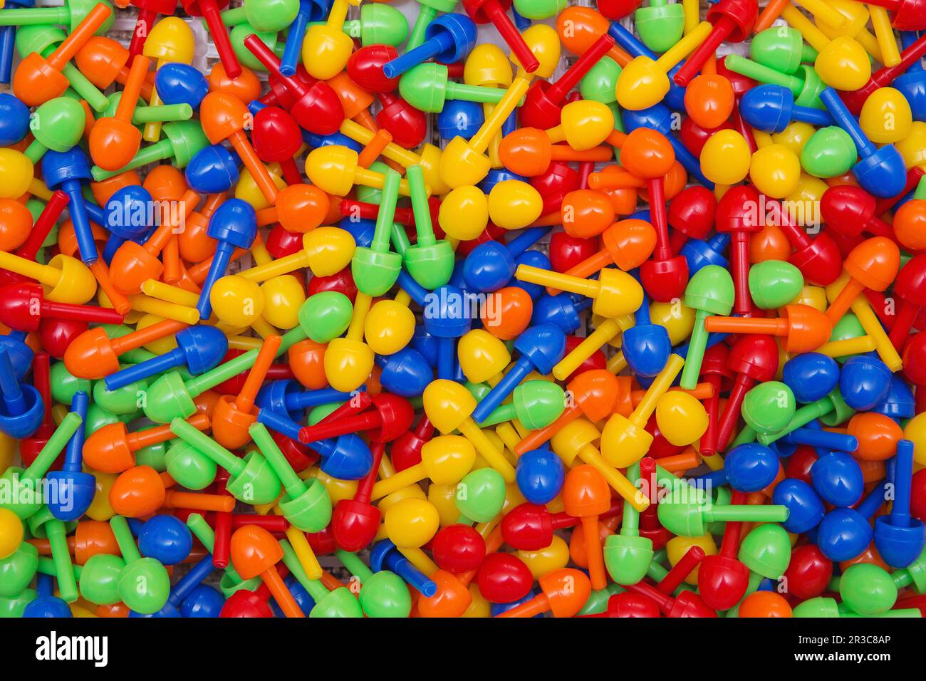 Colorful children's mosaic pieces background texture. Small plastic ...