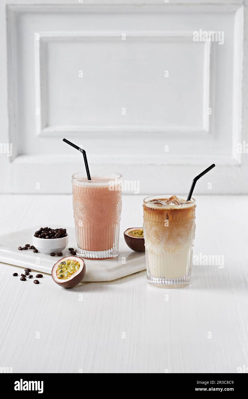Passion fruit drink and iced coffee in glasses Stock Photo - Alamy