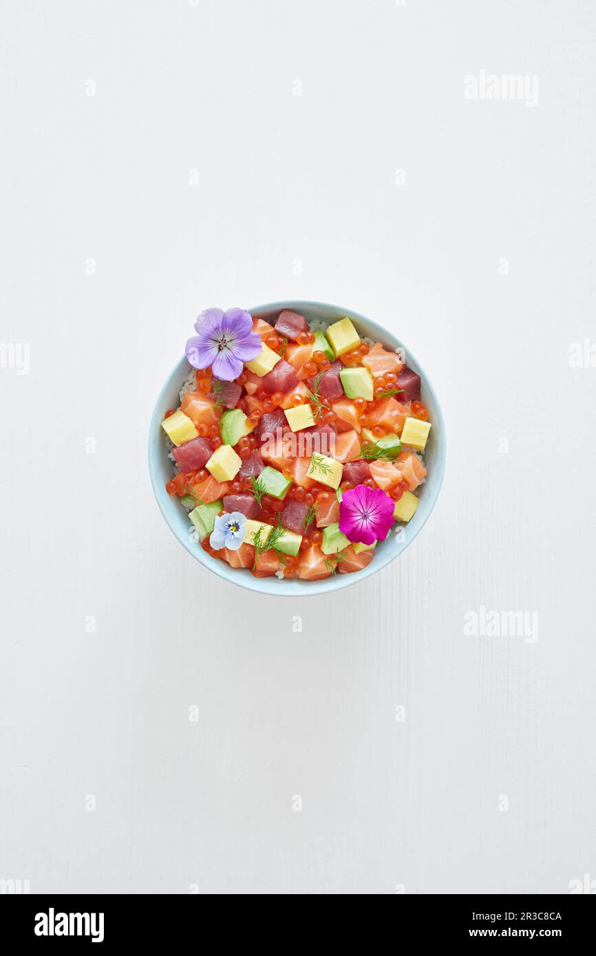 Japanese seafood bowl with edible flowers Stock Photo - Alamy