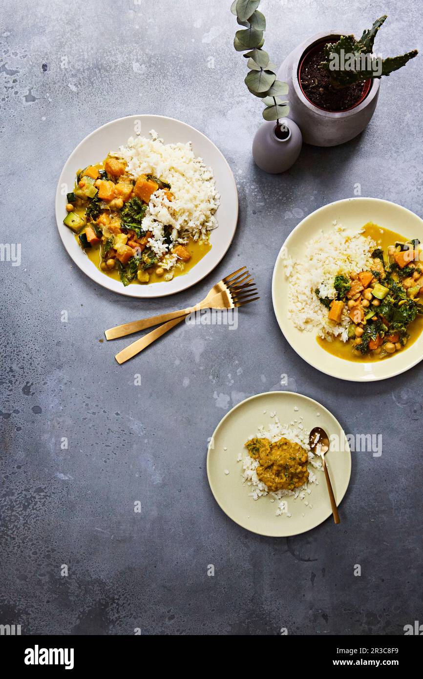 A family meal, vegetable curry for the child and parents Stock Photo ...