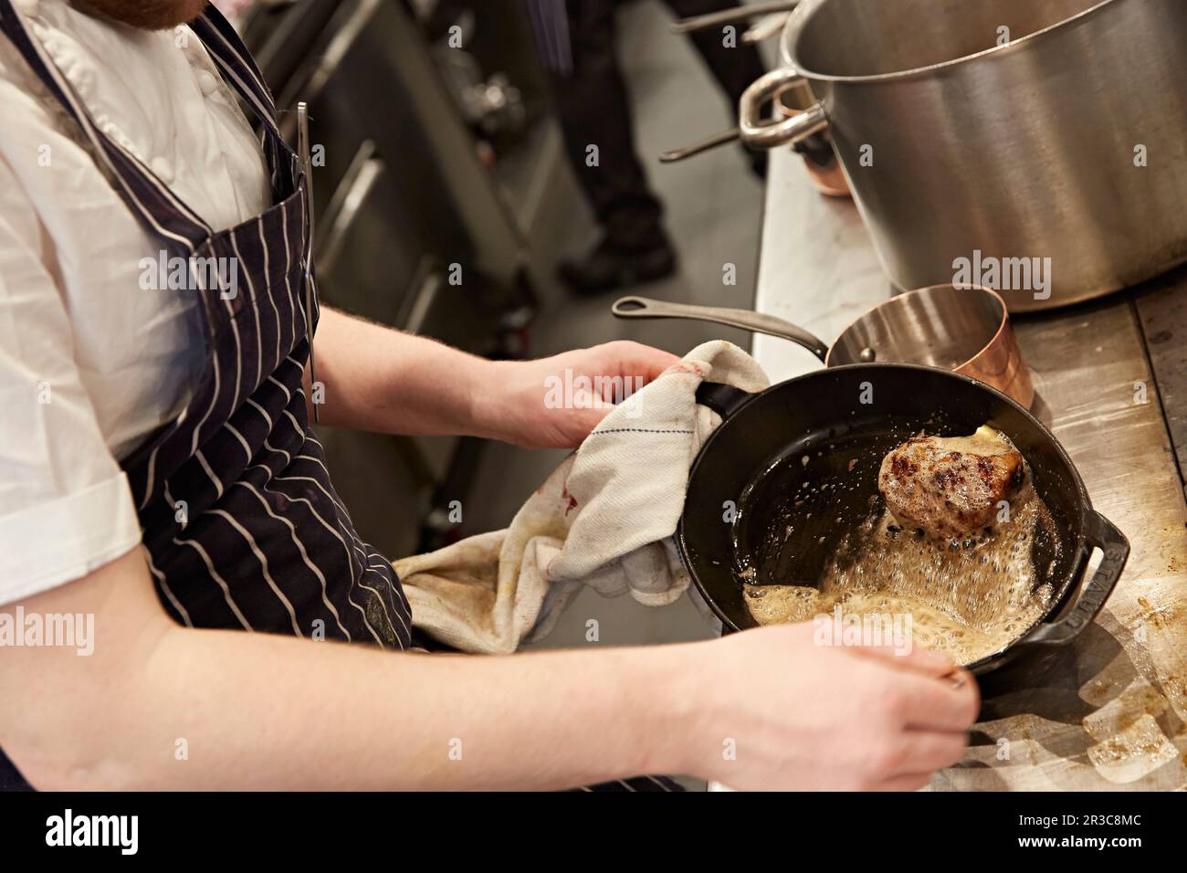 Chef frying beef steak hi-res stock photography and images - Alamy