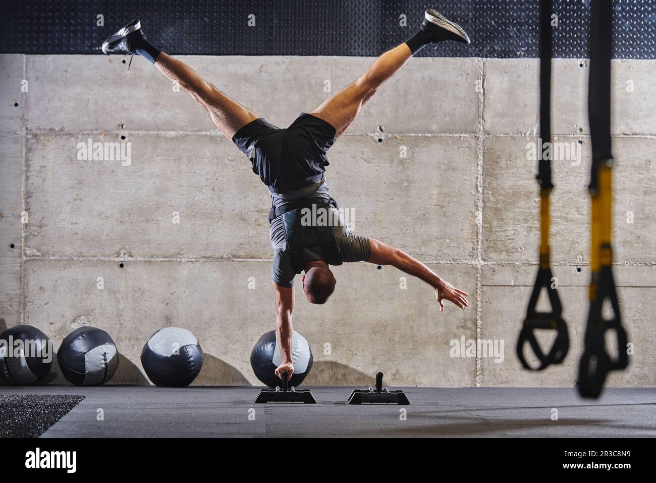 A muscular man in a handstand position, showcasing his exceptional ...