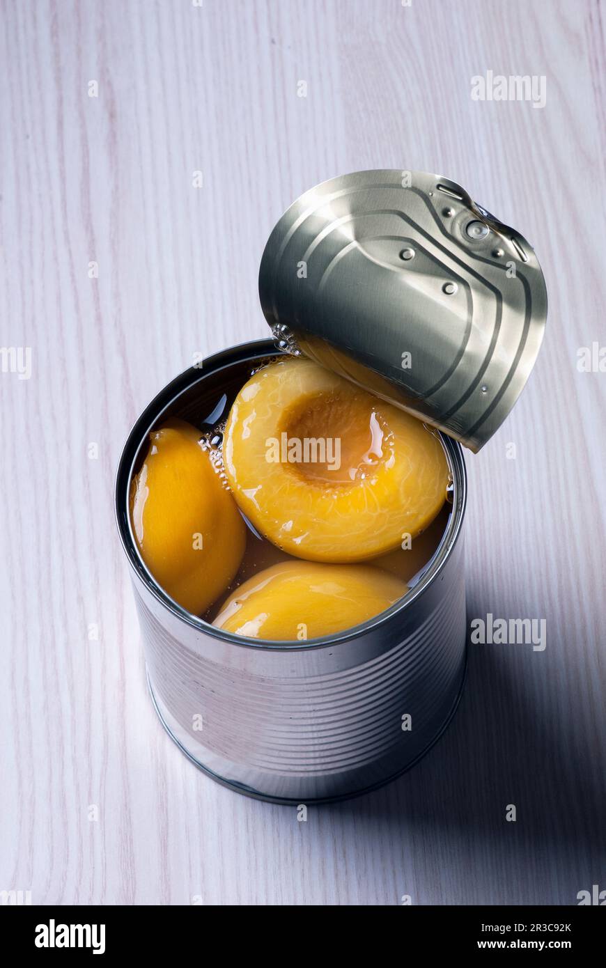 Canned peaches hi-res stock photography and images - Alamy