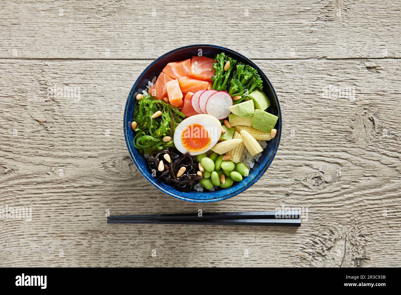 Poke bowl with rice, salmon, seaweed, vegetables and egg Stock Photo ...