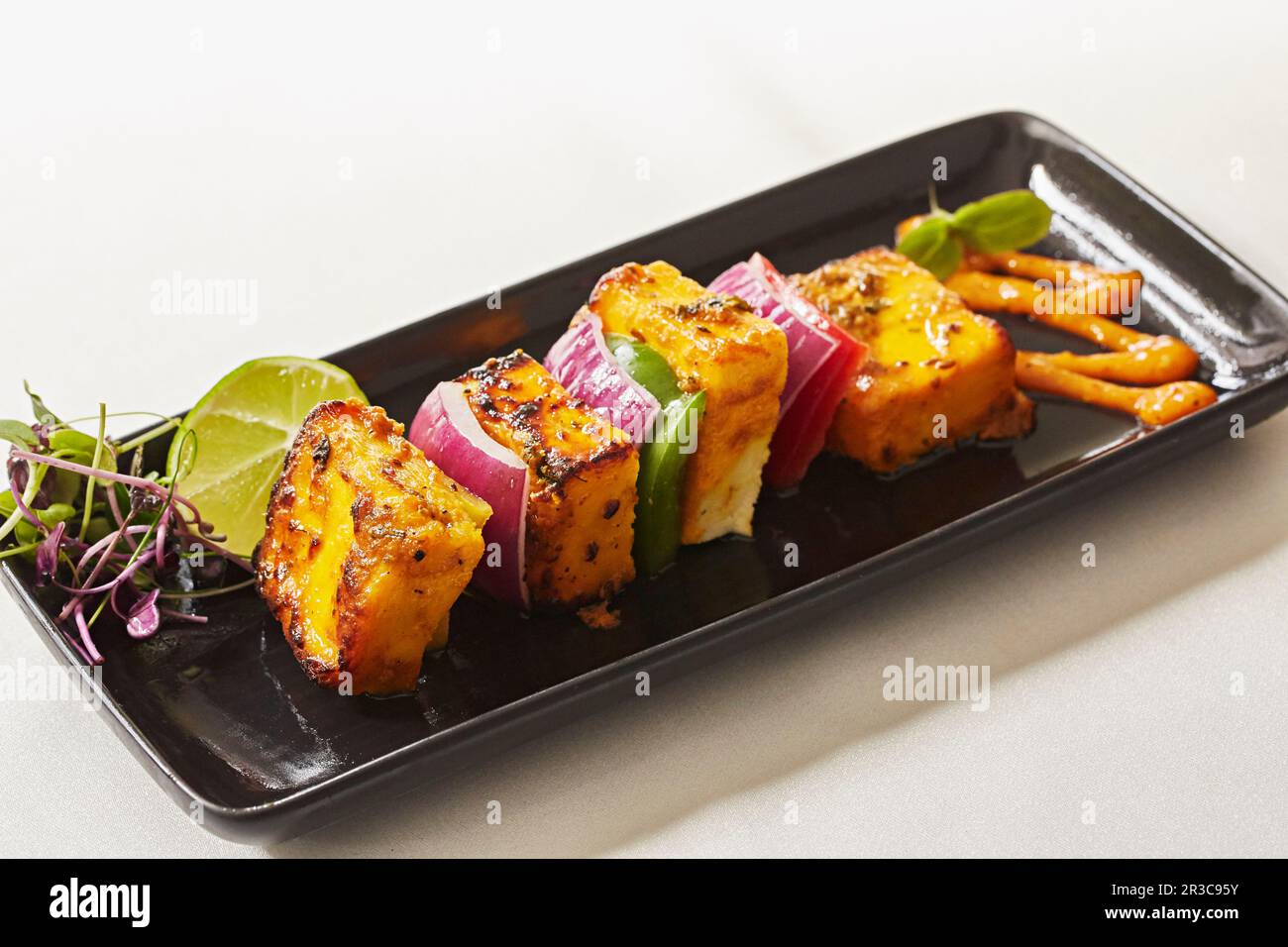 Indian spiced paneer and vegetable skewers Stock Photo - Alamy