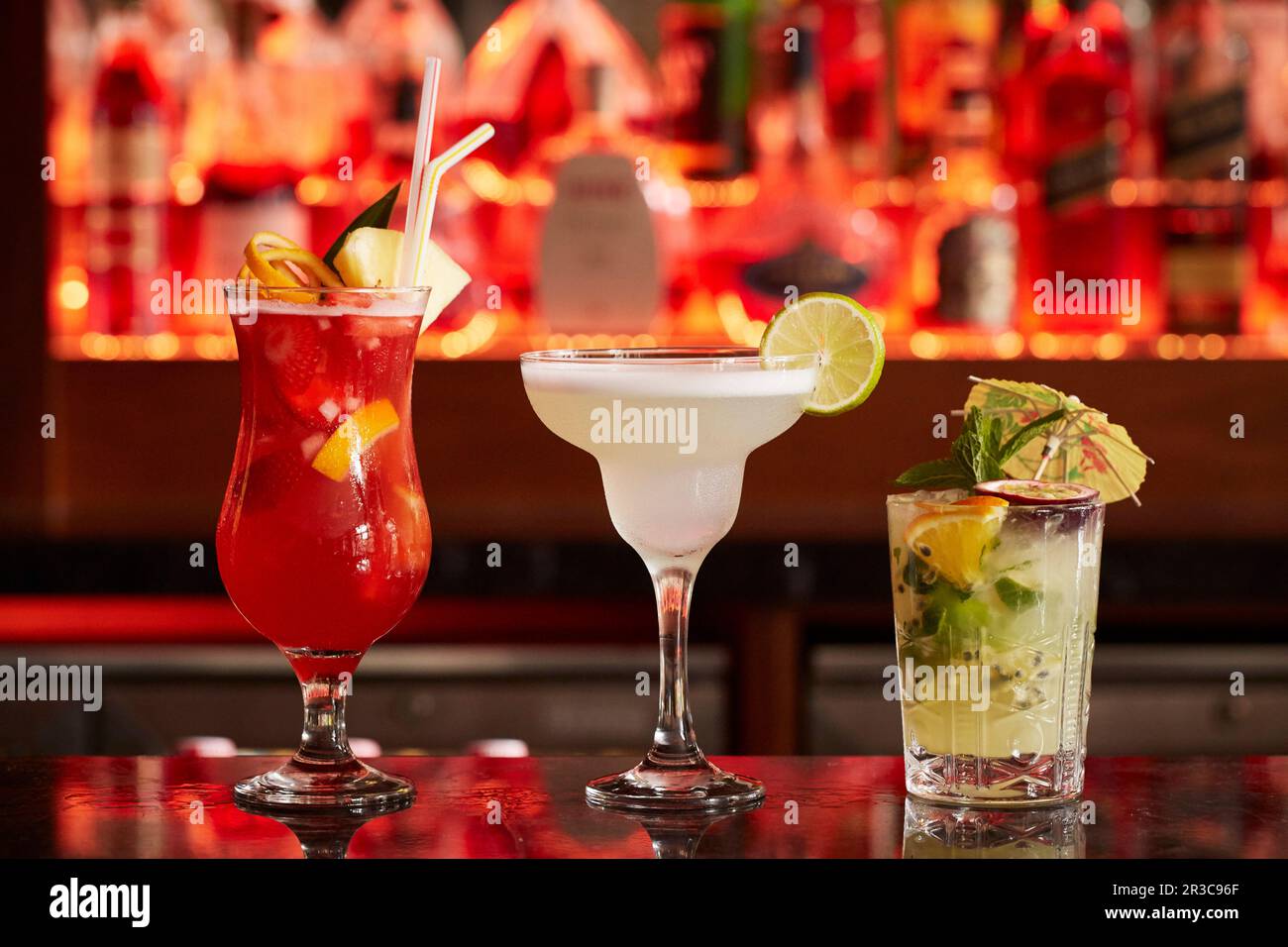 Three cocktails on a bar Stock Photo - Alamy