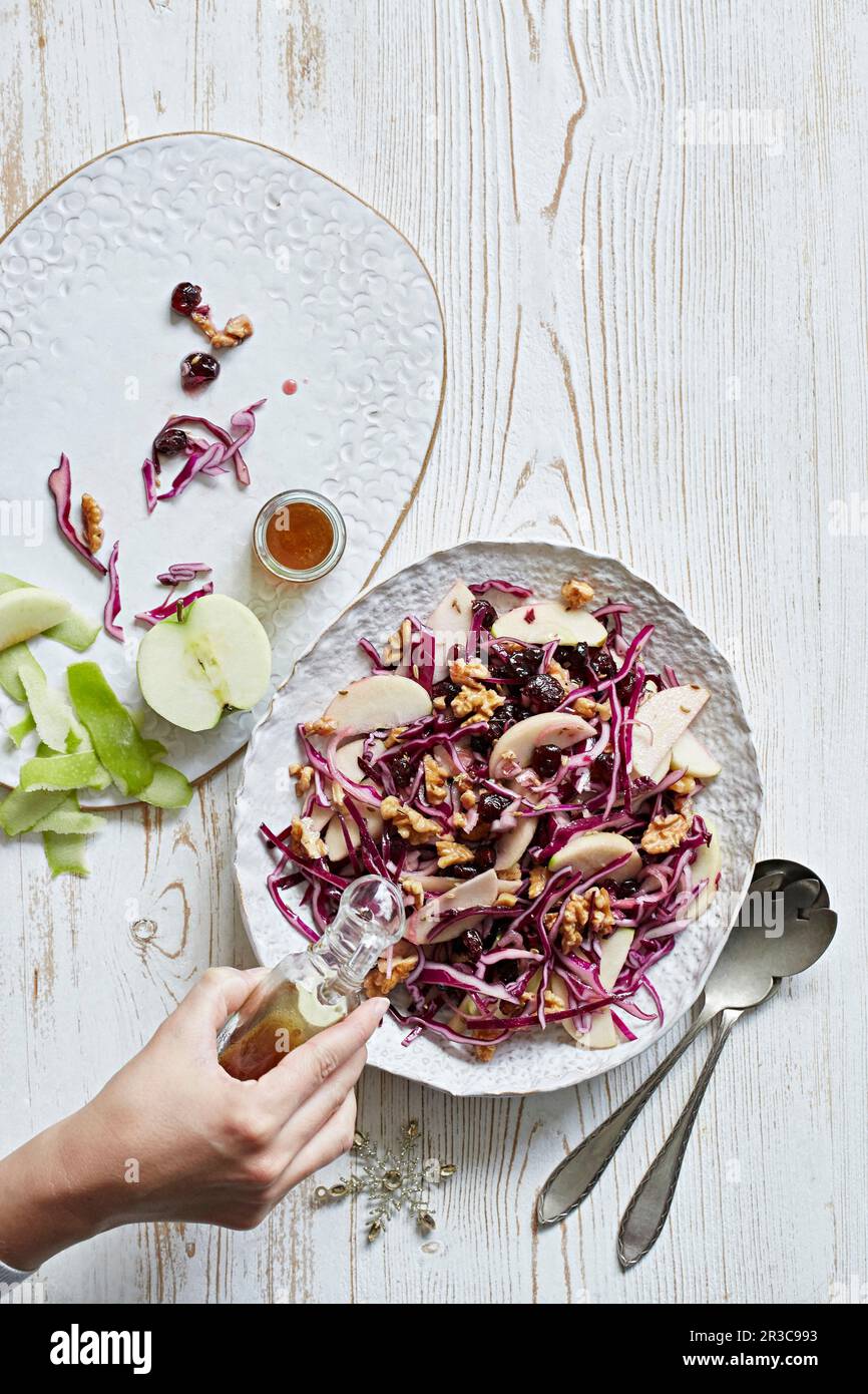 Apple, cabbage and walnut salad Stock Photo - Alamy