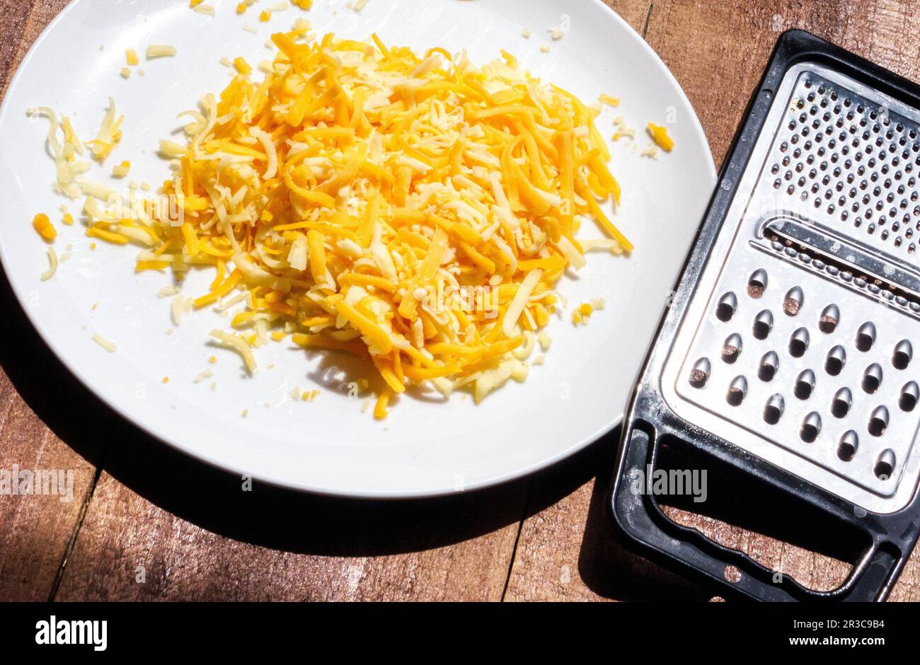 Grated cheese plate hi-res stock photography and images - Alamy
