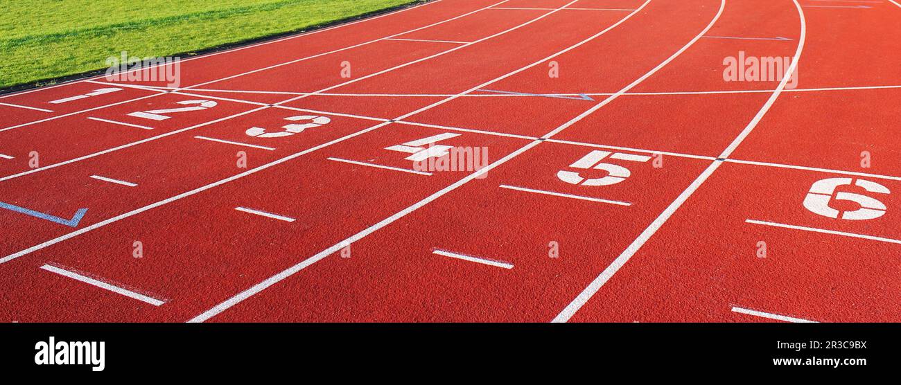 Red running track starting line with number Stock Photo - Alamy