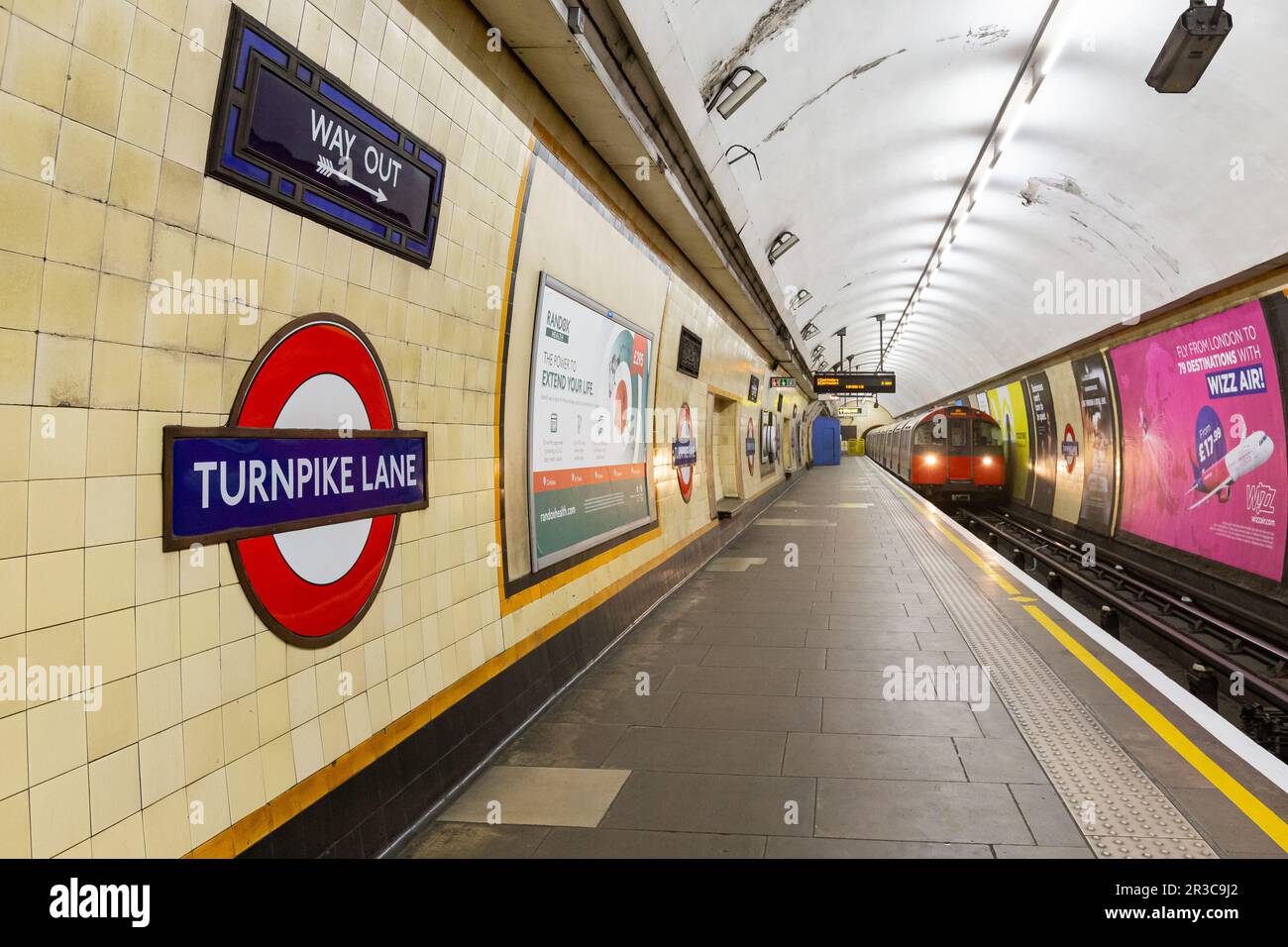 Turnpike Lane platform with Piccadilly Line service Stock Photo - Alamy