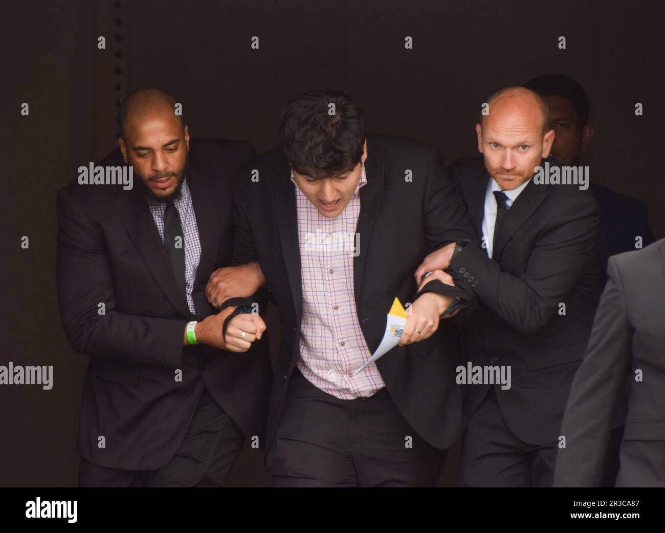 London, England, UK. 23rd May, 2023. A climate activist is removed from ...