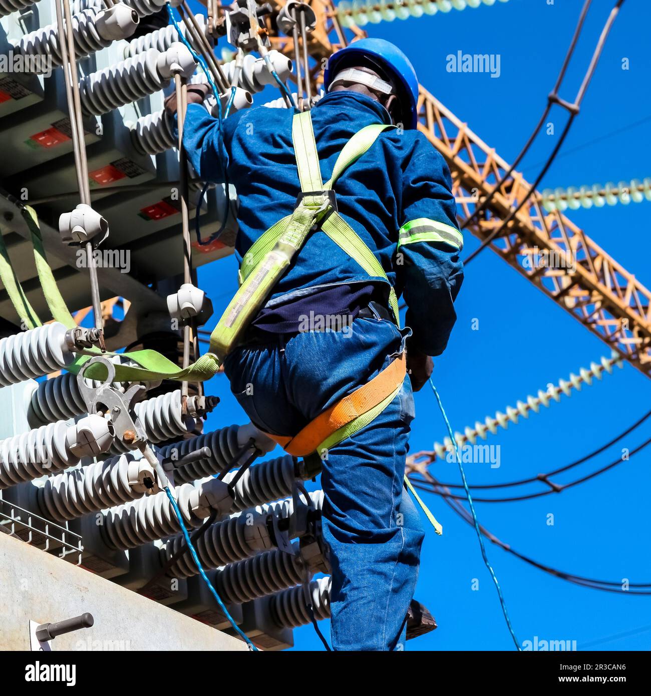 Man working on Electric Power Lines Stock Photo - Alamy