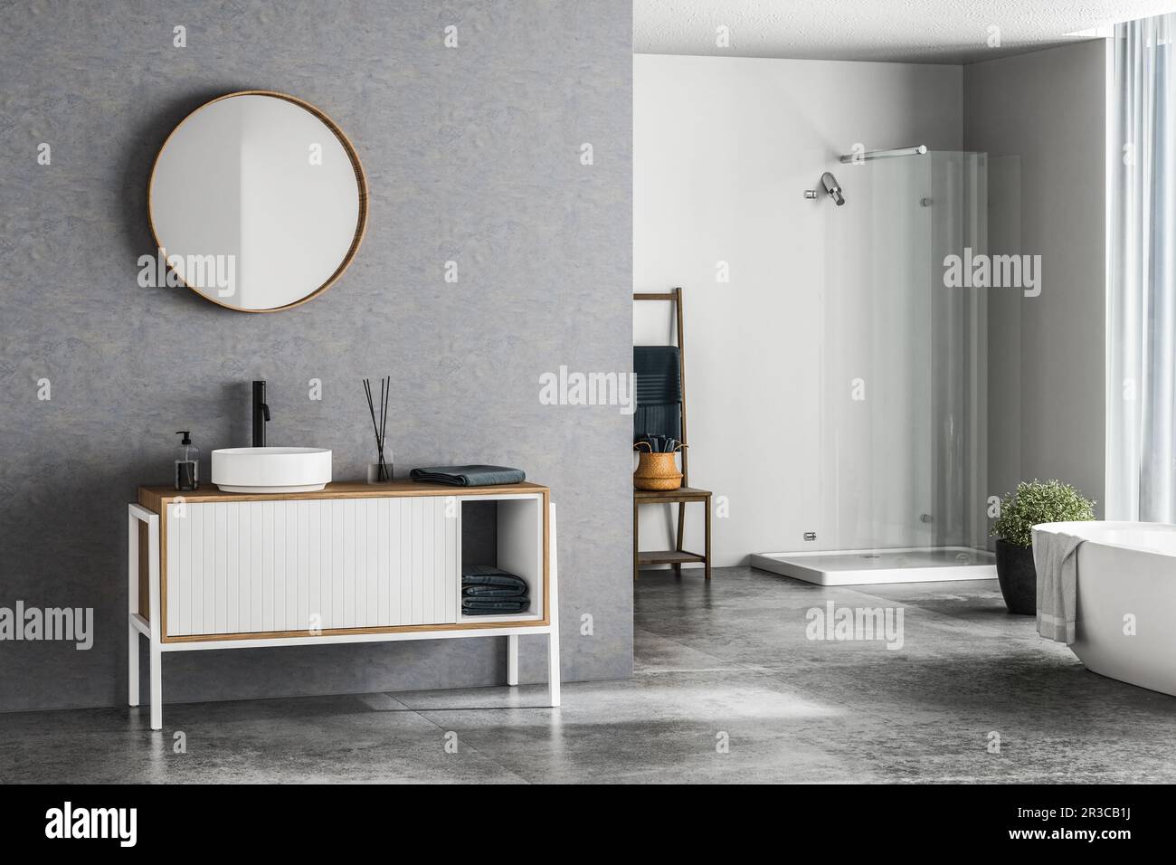 Modern bathroom interior with blue background, concrete flooring, white ...