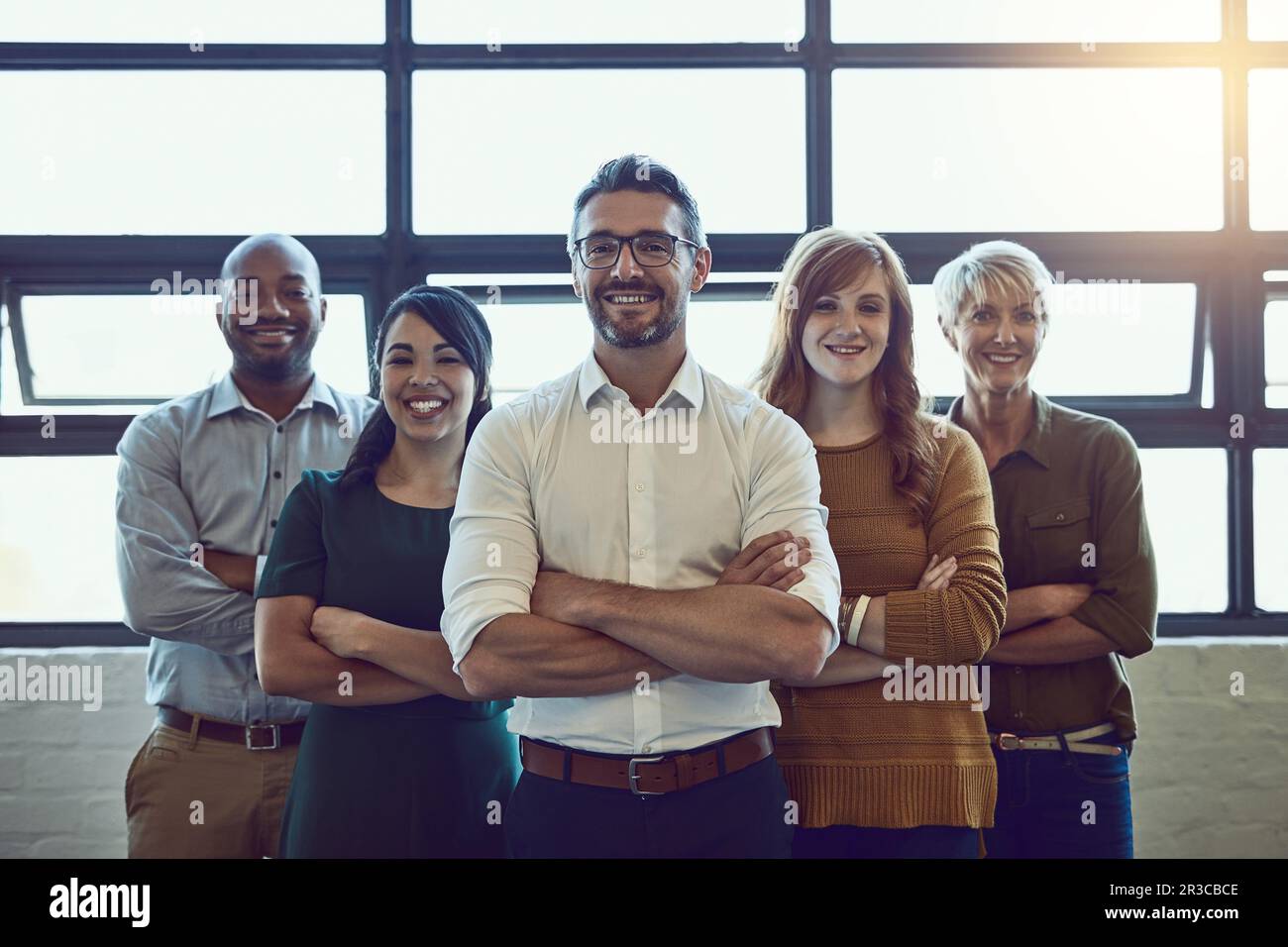 Smile, crossed arms and portrait of a business team in office for unity ...