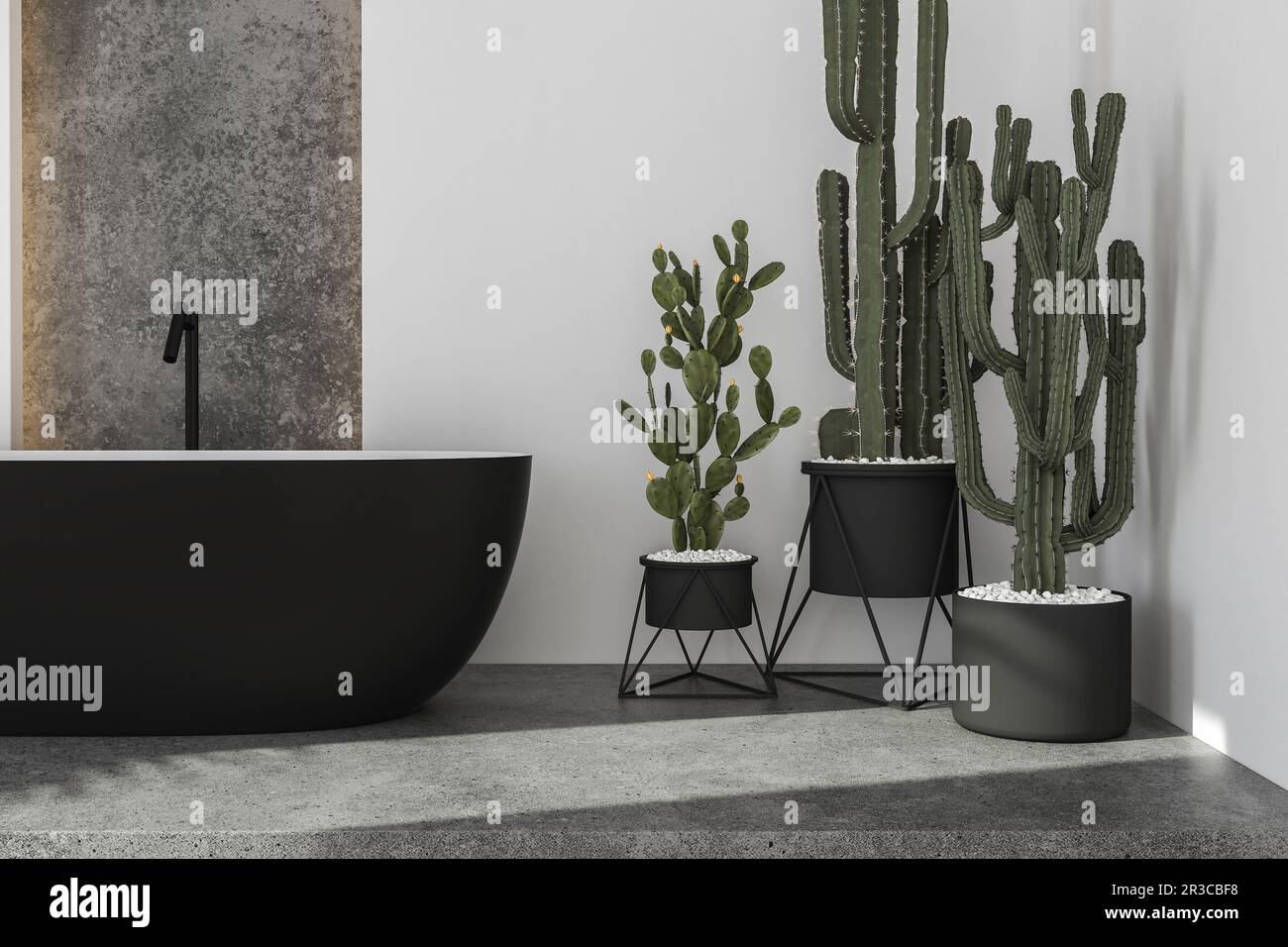 A black white bathtub standing on a concrete platform with white and ...