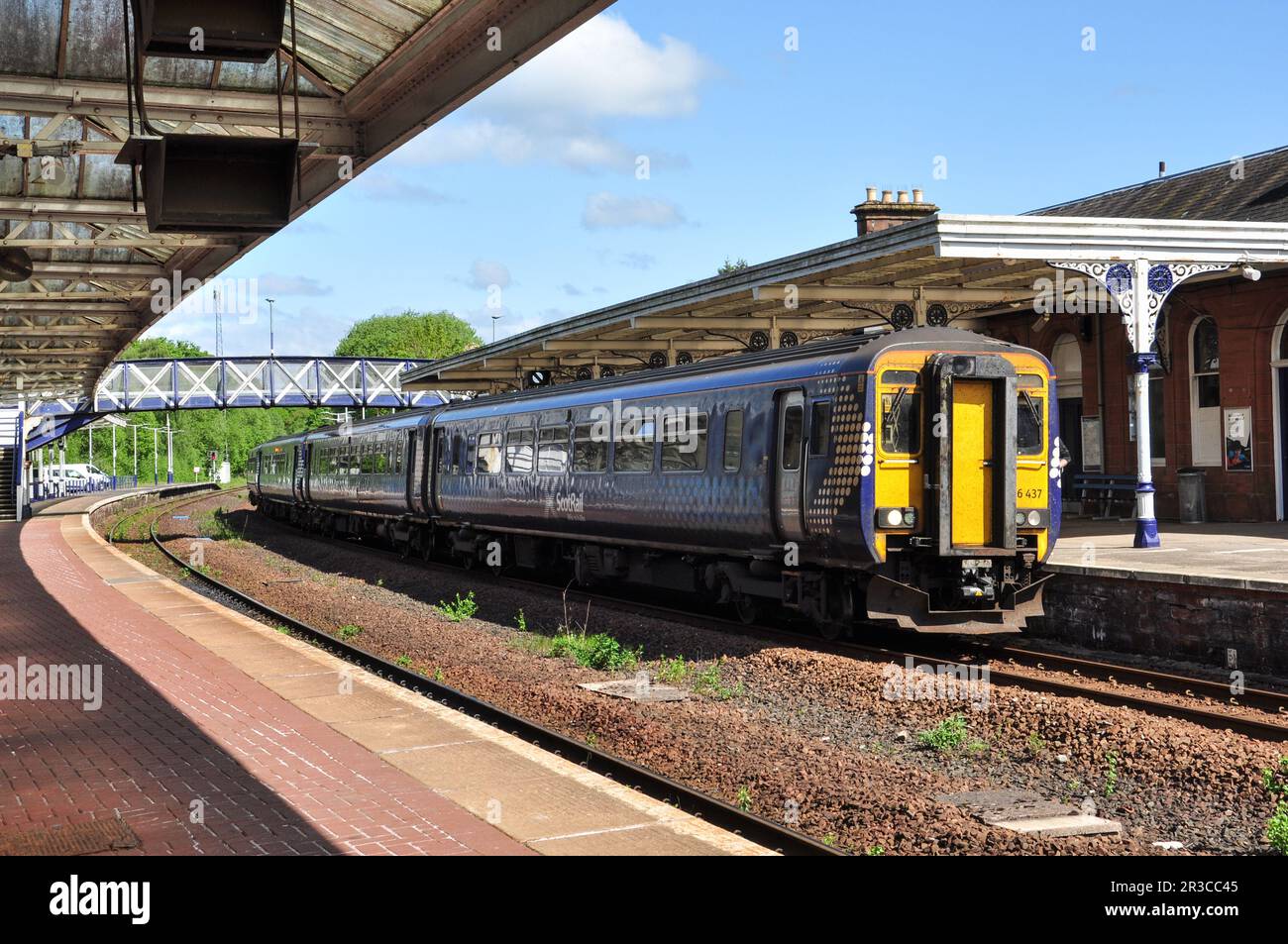 Class 156 DMU by the platform awning at Dumfries railway station ...