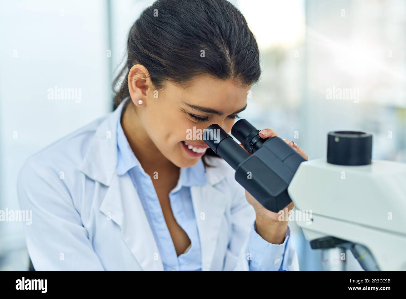 Research, woman and scientist smile with microscope in laboratory for ...