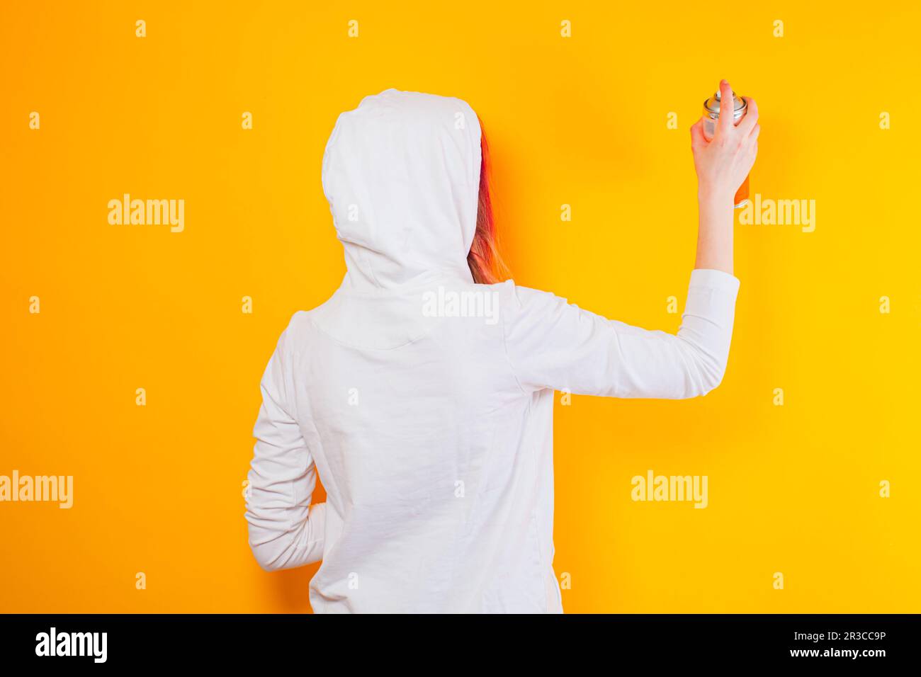 The unknown girl trying to draw graffiti Stock Photo - Alamy