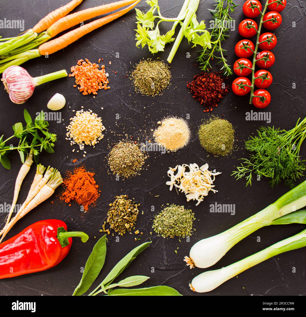 Fresh vegetables around piles of dry seasoning Stock Photo - Alamy