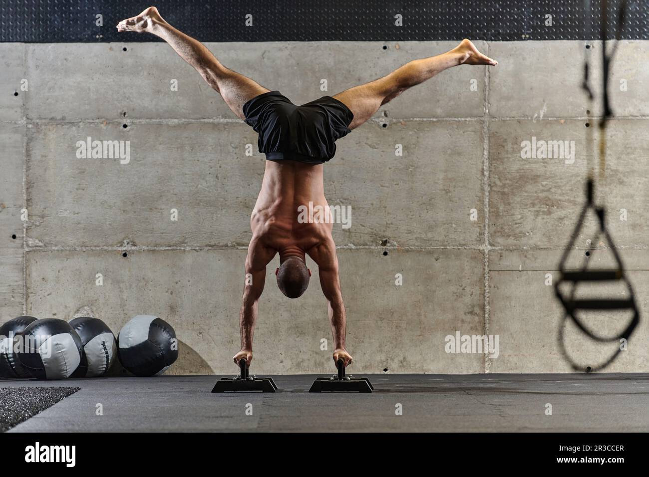 A muscular man in a handstand position, showcasing his exceptional ...