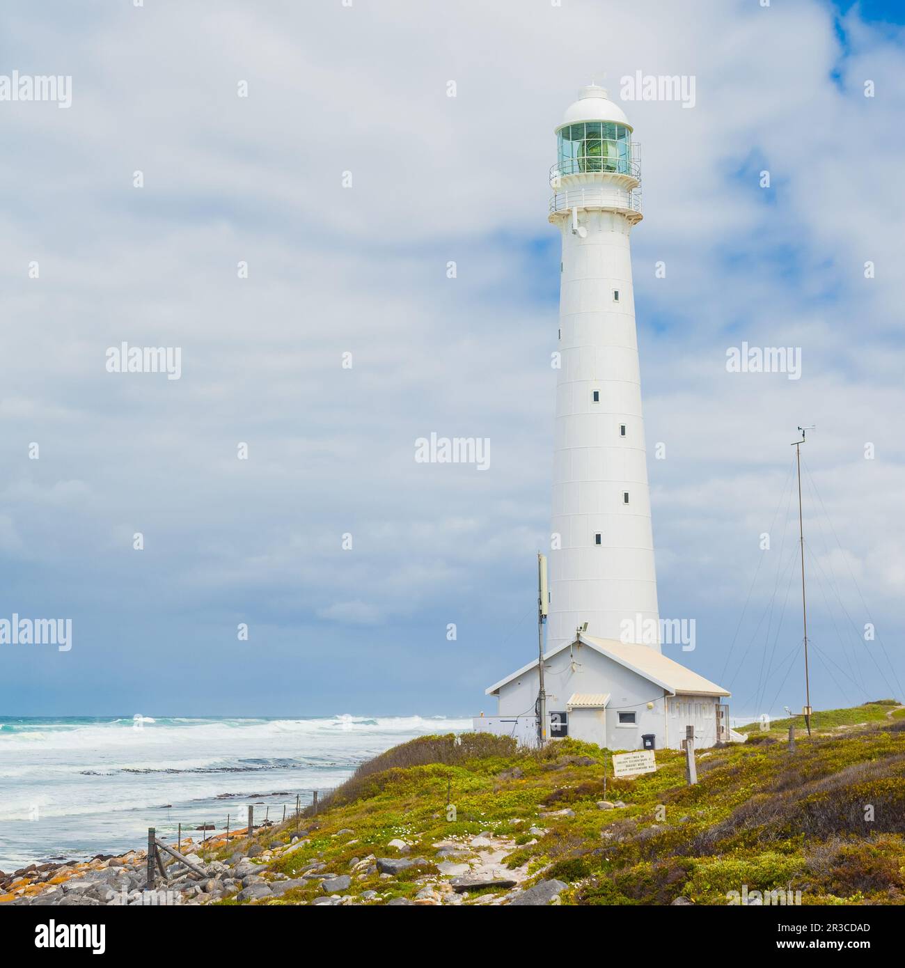 Lighthouse on a rugged coastline during the daytime Stock Photo - Alamy