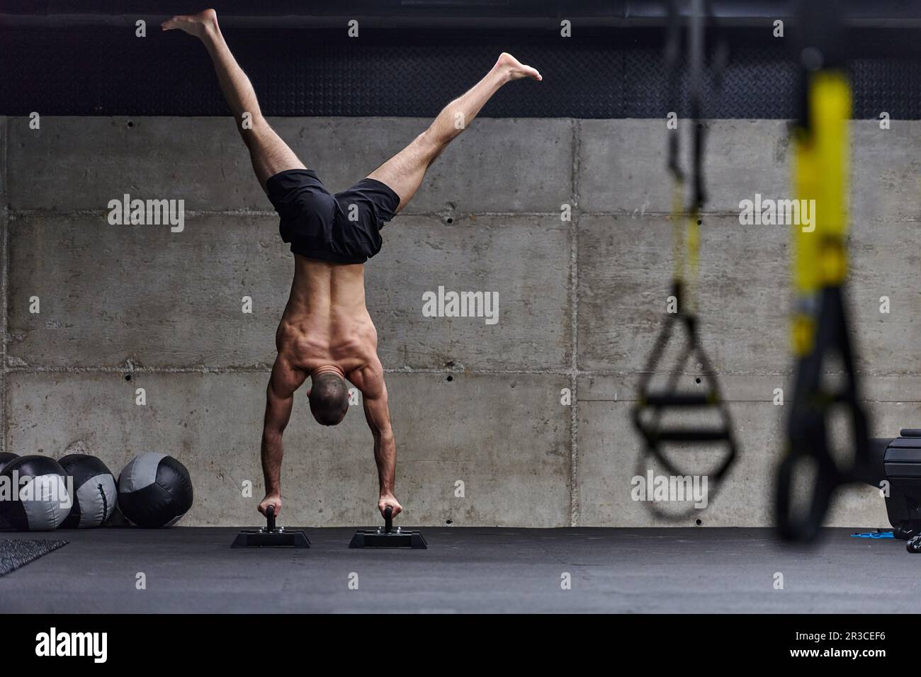 A muscular man in a handstand position, showcasing his exceptional ...