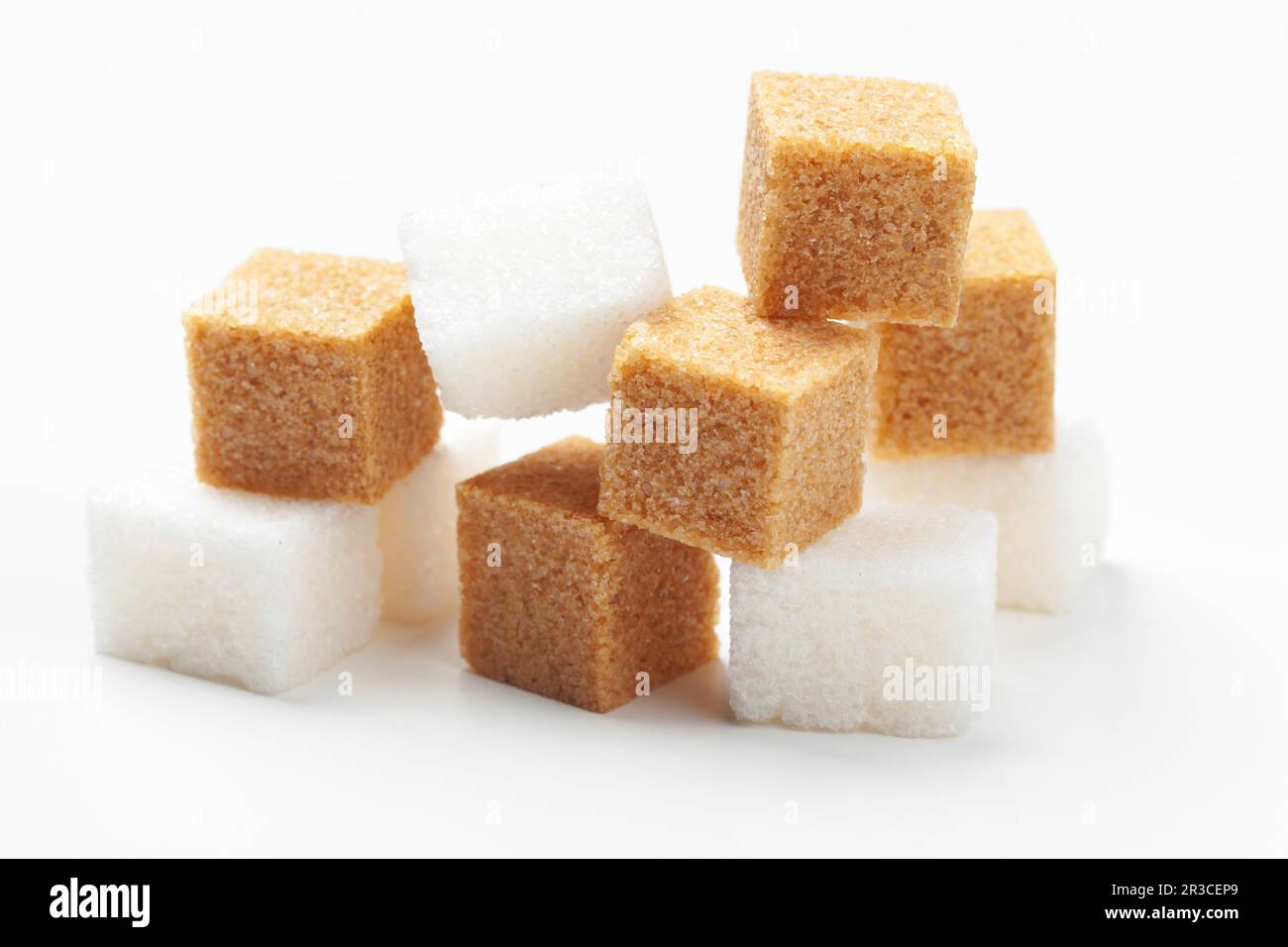 White refined sugar and brown unrefined sugar cubes Stock Photo - Alamy