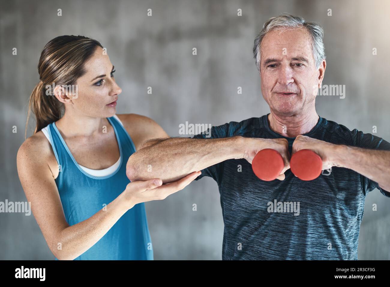 Helping, dumbbell and fitness with old man and personal trainer for ...