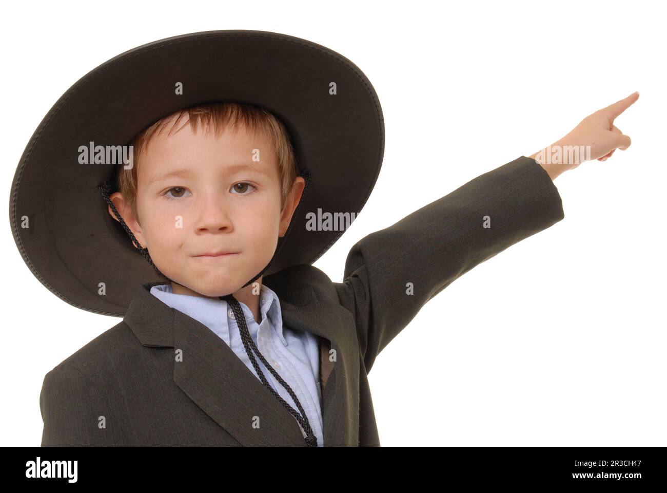 Young boy in suit wearing a western style hat pointing Stock Photo - Alamy