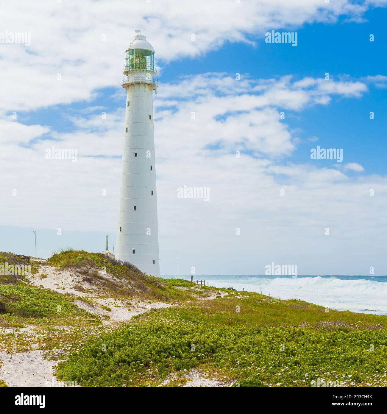 Lighthouse on a rugged coastline during the daytime Stock Photo - Alamy