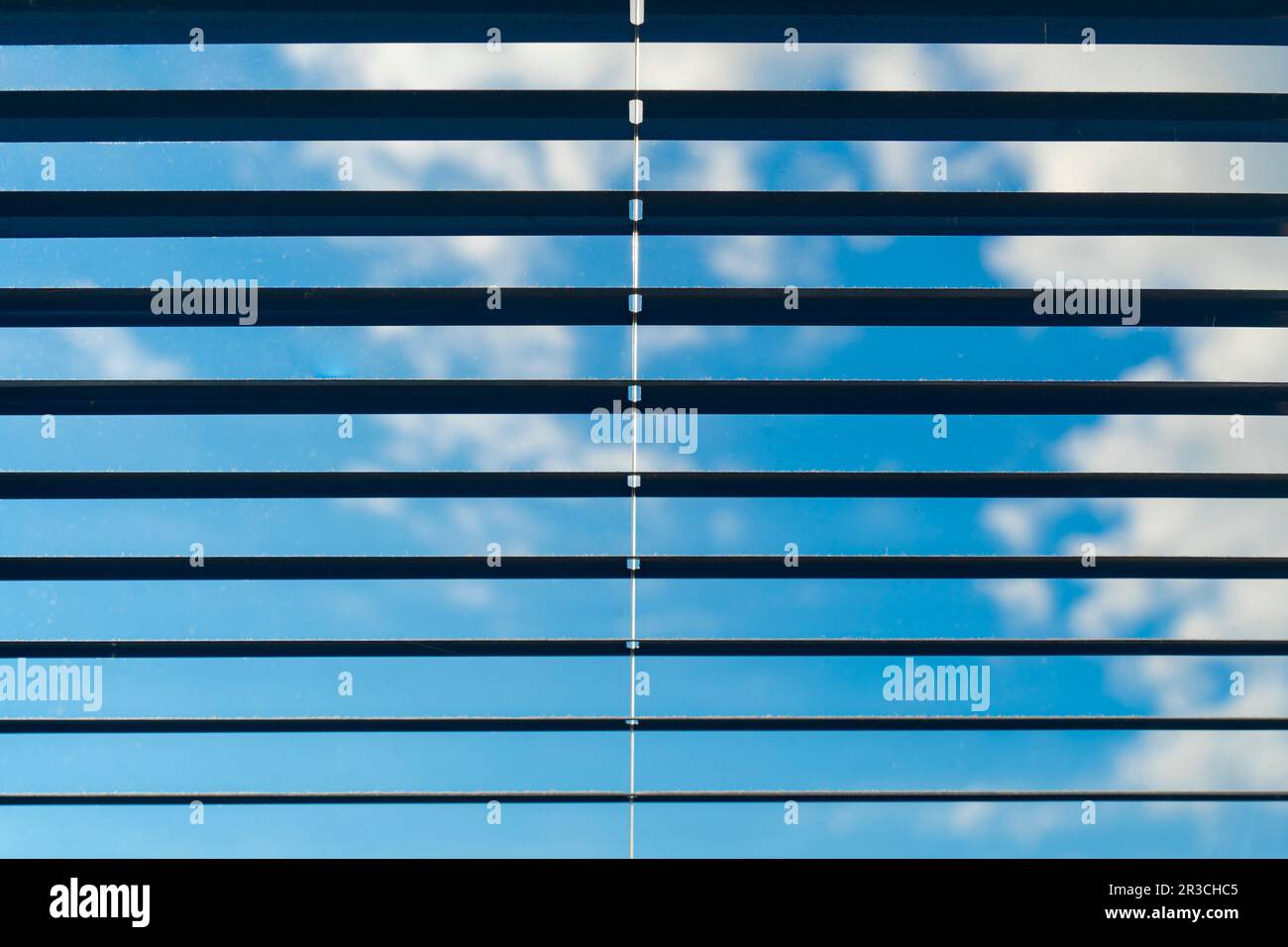 Window blinds in front of the blue sky Stock Photo - Alamy